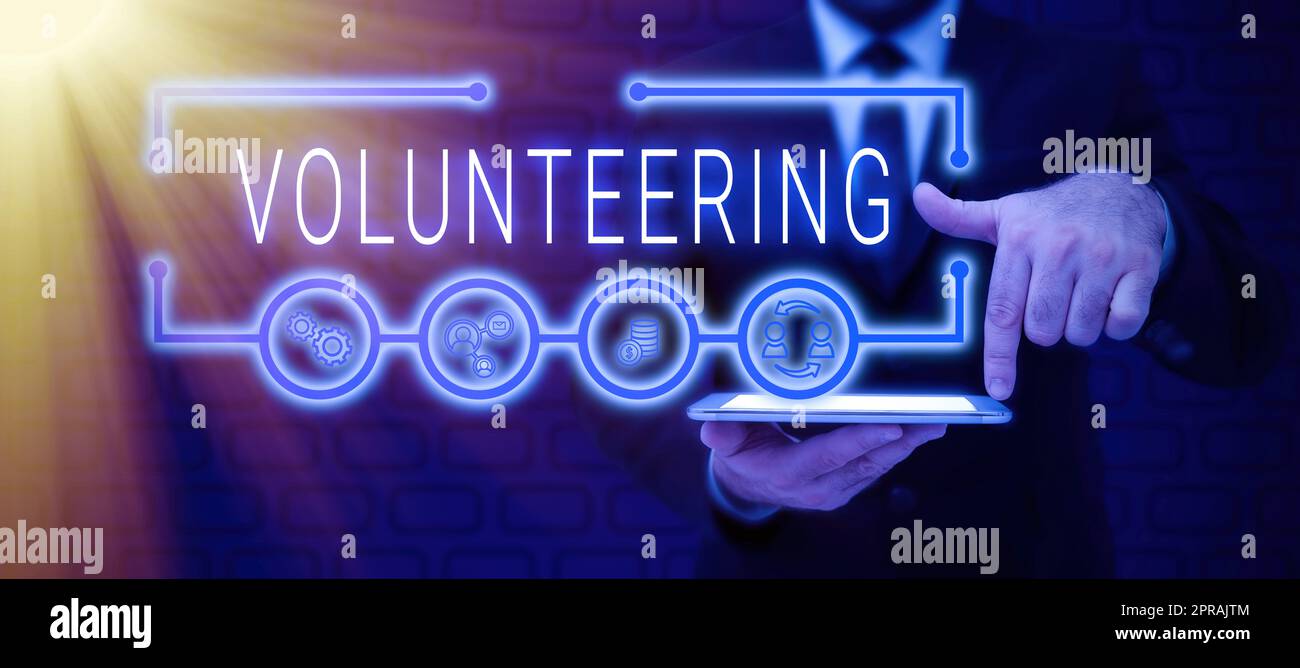 Text sign showing Volunteering. Concept meaning Provide services for no ...