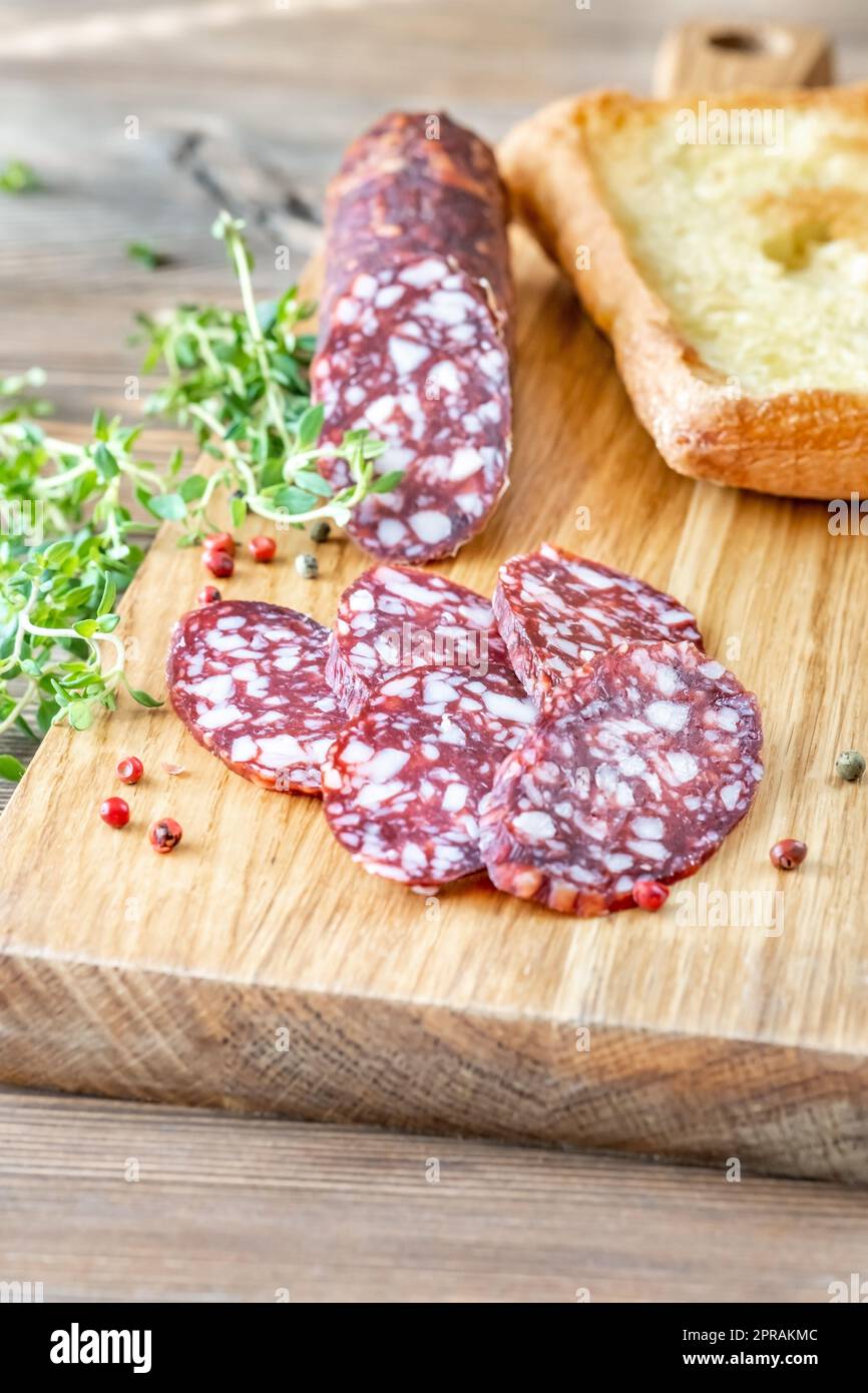 Braunschweiger sausage on the wodden cutting board Stock Photo - Alamy