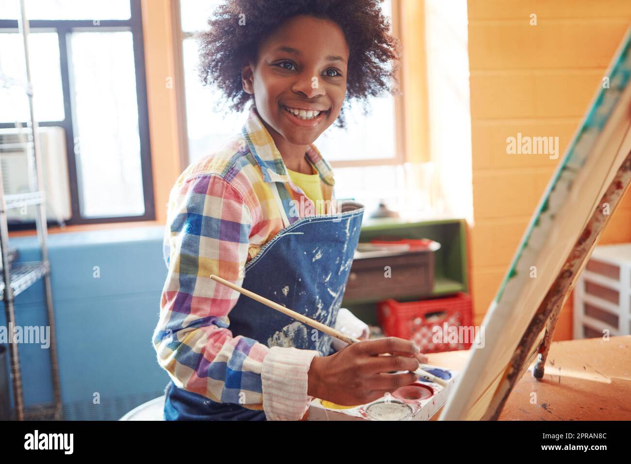 Art is awesome. Portrait of a young schoolgirl in an art class Stock ...