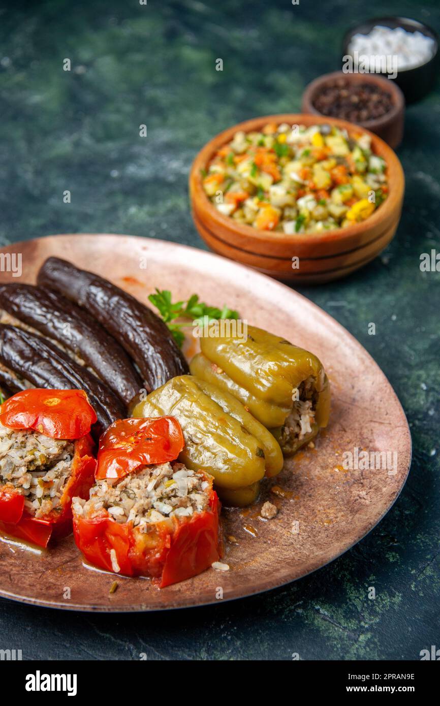 front view tasty vegetable dolma on a blue background food color dish ...