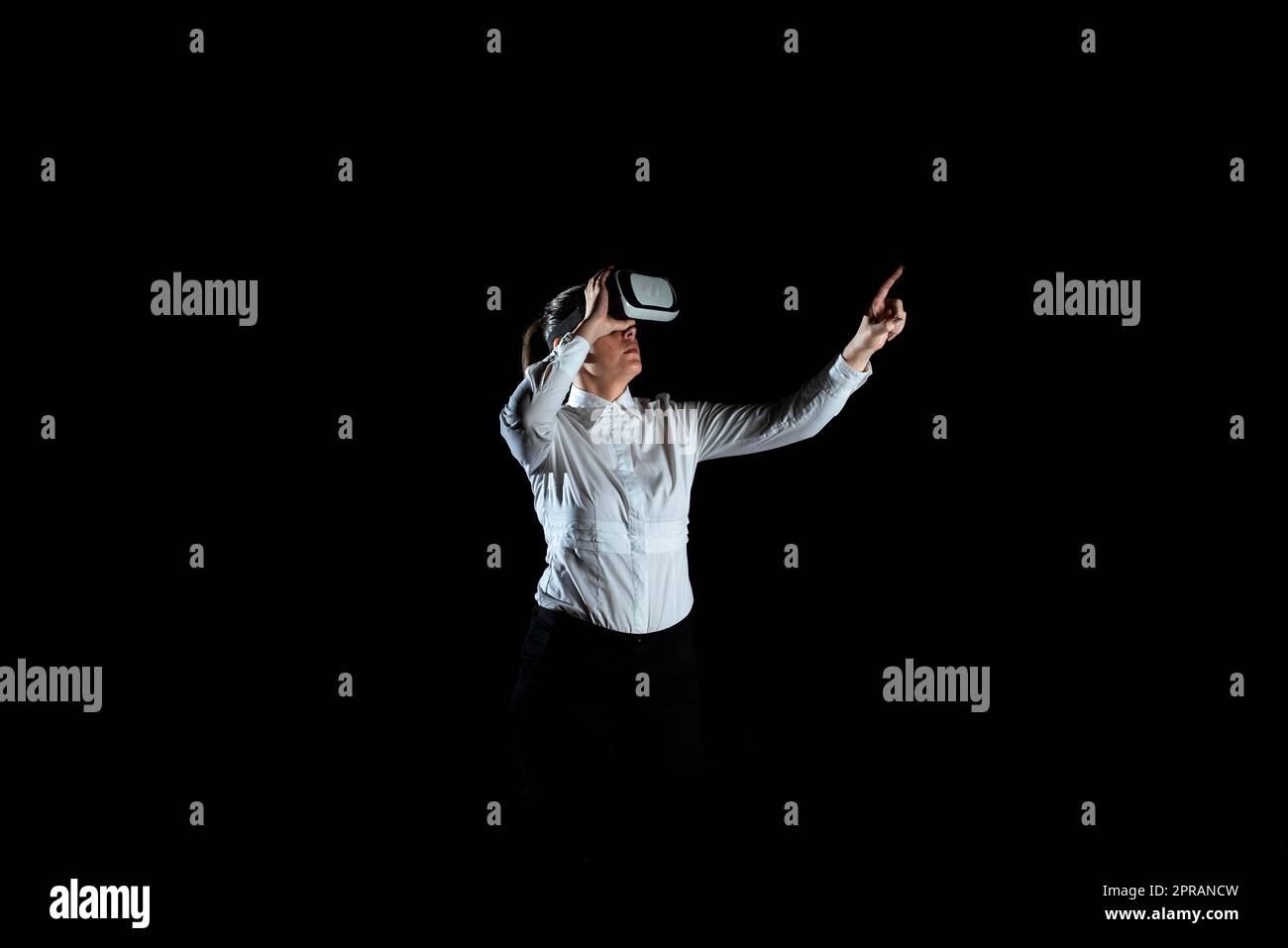 Female Professional Wearing Virtual Reality Headset Gesturing And ...