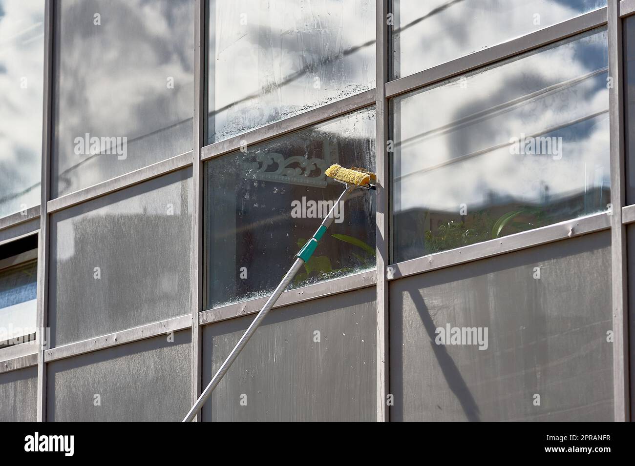 window washing, washing a street shop window Stock Photo - Alamy