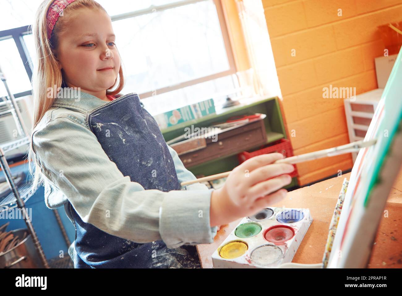 Channeling her inner Picasso. a young schoolgirl in an art class Stock ...