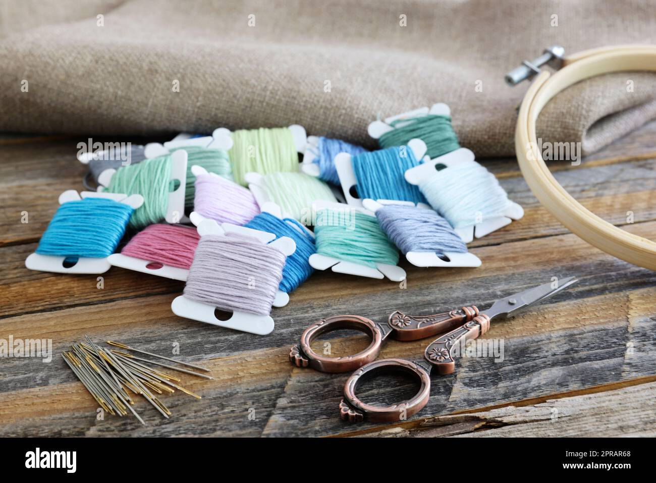 Embroidery Tools on Rustic Table Stock Photo - Alamy