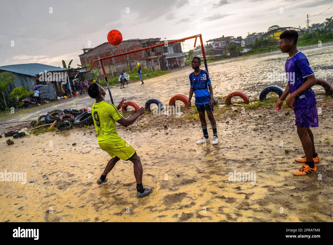 Young Afro-Colombian football players perform a circle passing drill ...