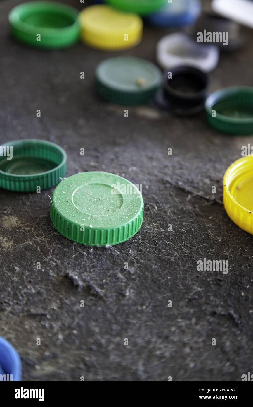 Dirty plastic caps Stock Photo - Alamy