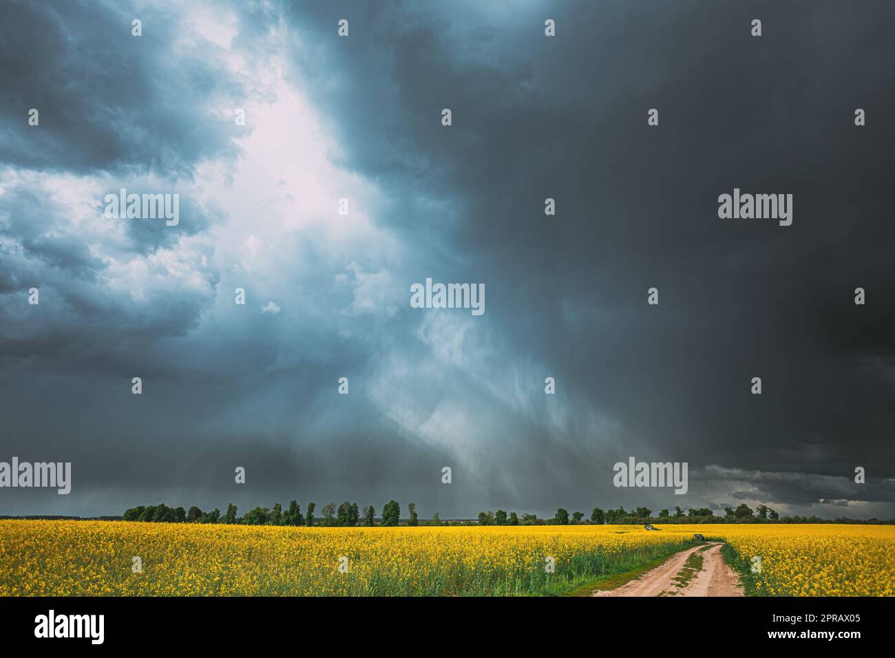 Dramatic Rain Sky With Rain Clouds On Horizon Above Rural Landscape ...