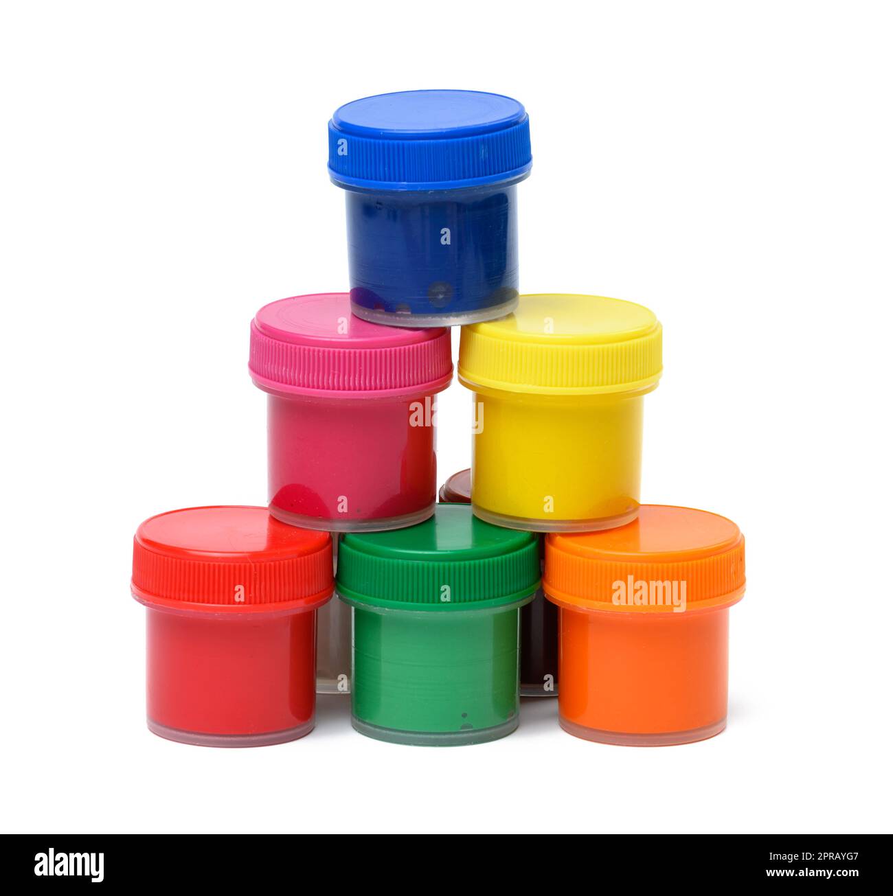 Plastic jars with multi-colored gouache on a white isolated background ...