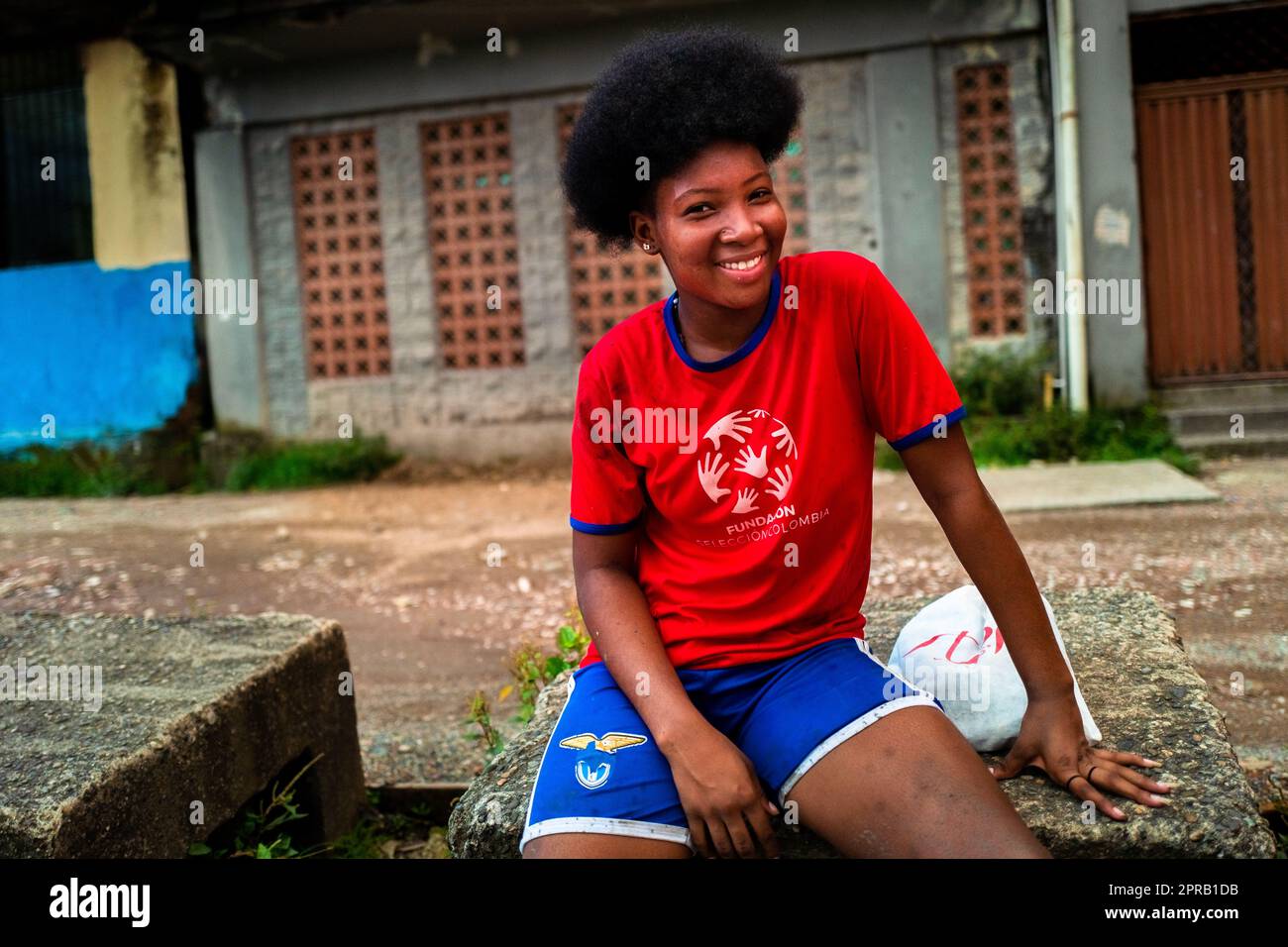 An Afro-Colombian female football player poses for a picture after the ...