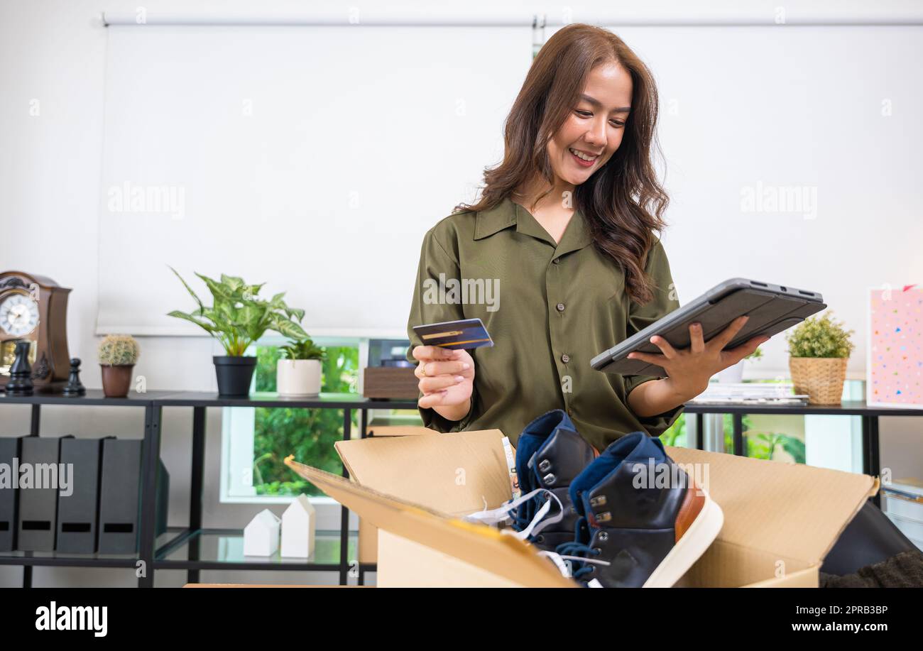 woman received online shopping parcel opening shoes boxes to checking ...
