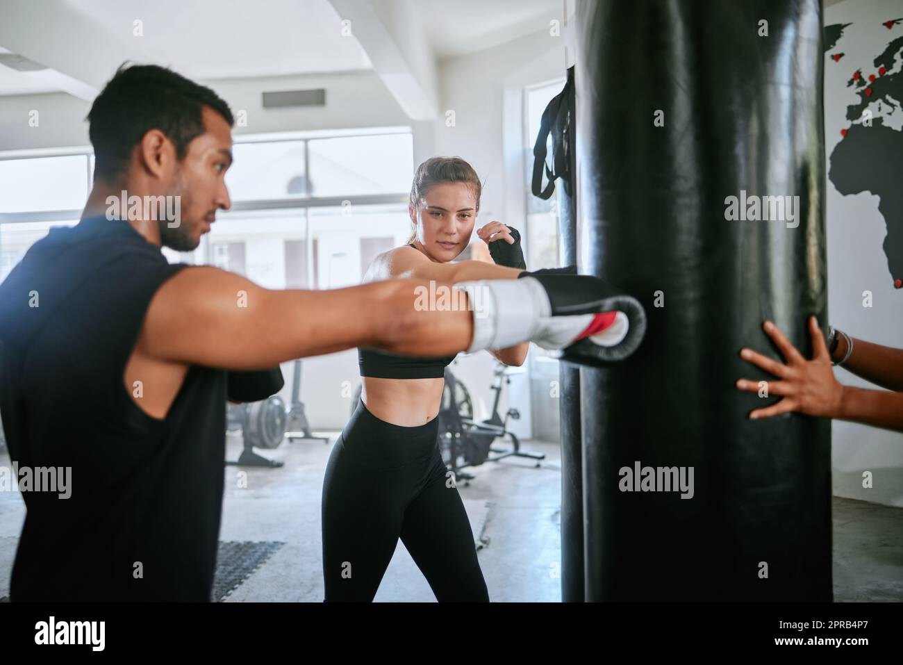 Healthy, fit and active woman boxing, training and exercising with her ...
