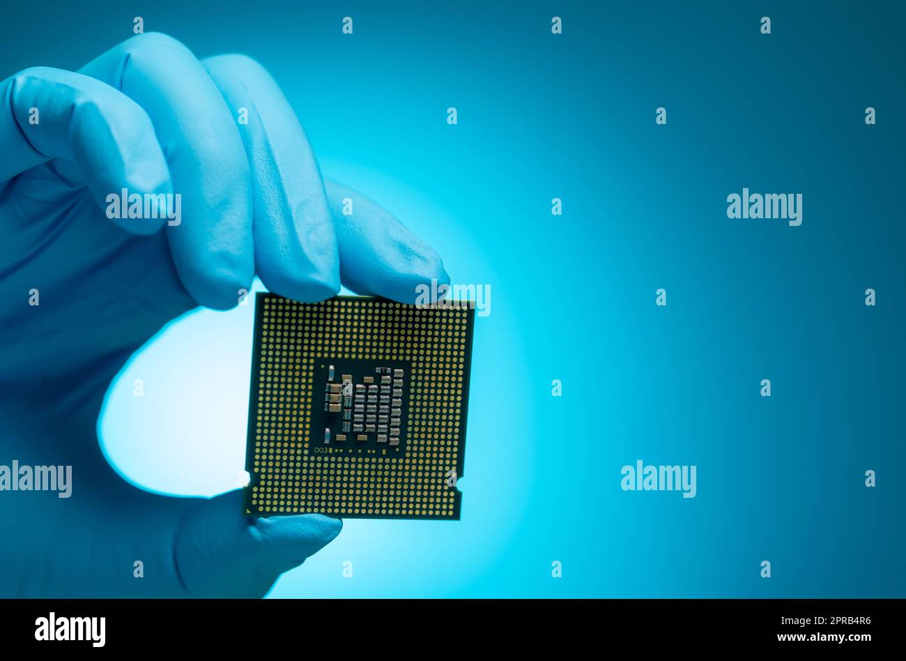 Electronic engineer hand holding computer chip blue background. Chipset ... Electronic engineer hand holding computer chip blue background. Chipset ...