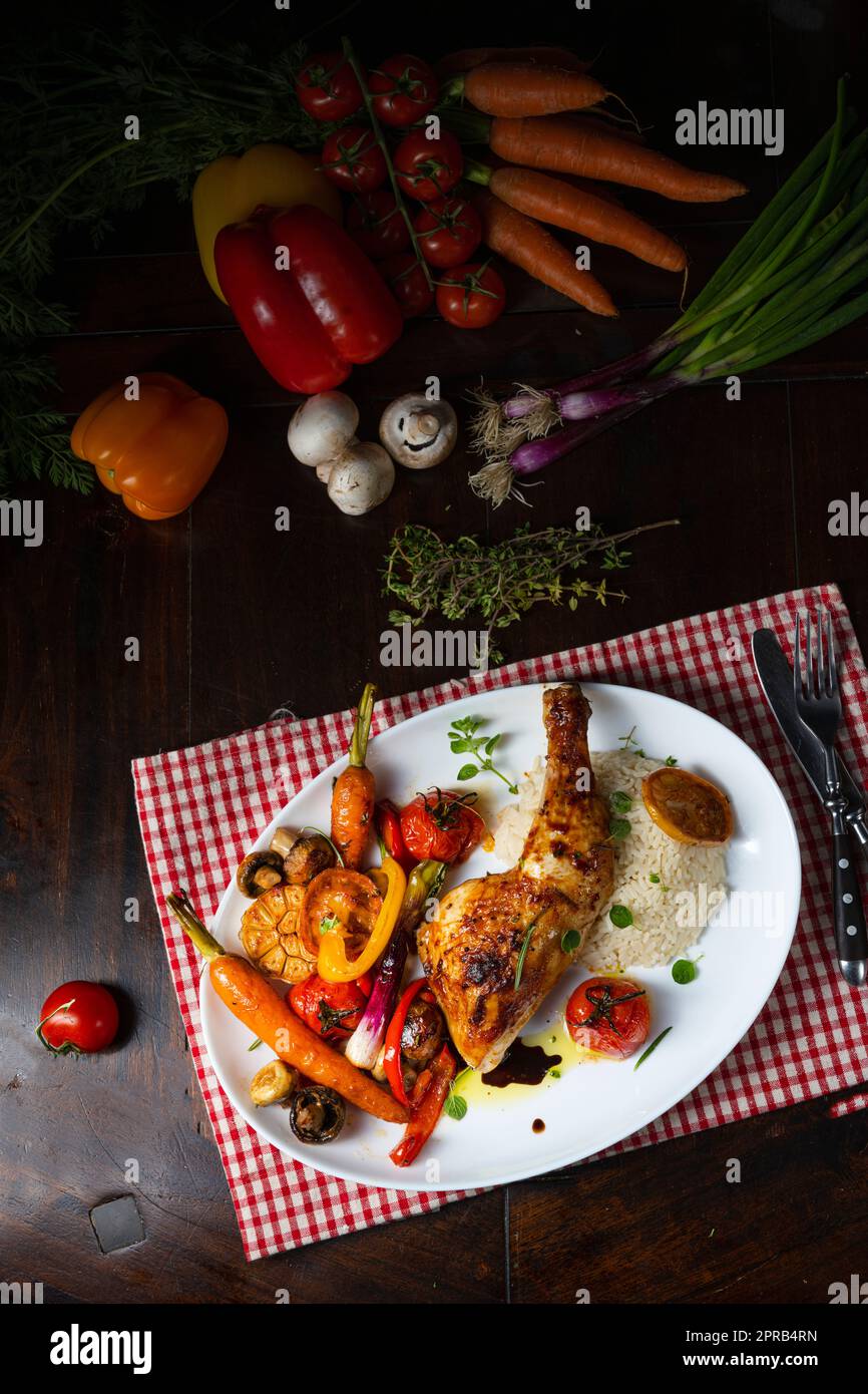 Rustic fried chicken legs with assorted vegetables and rice Stock Photo ...
