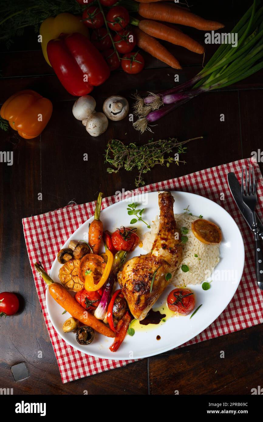 Rustic fried chicken legs with assorted vegetables and rice Stock Photo ...