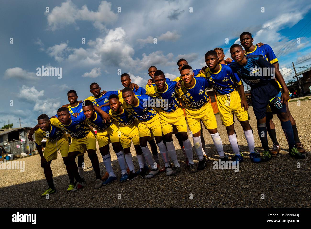 Young Afro-Colombian football players pose for a team photo before ...