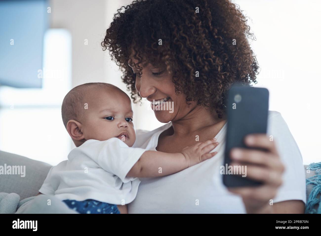 Our fondest memories are made with mom. a young woman taking selfies ...