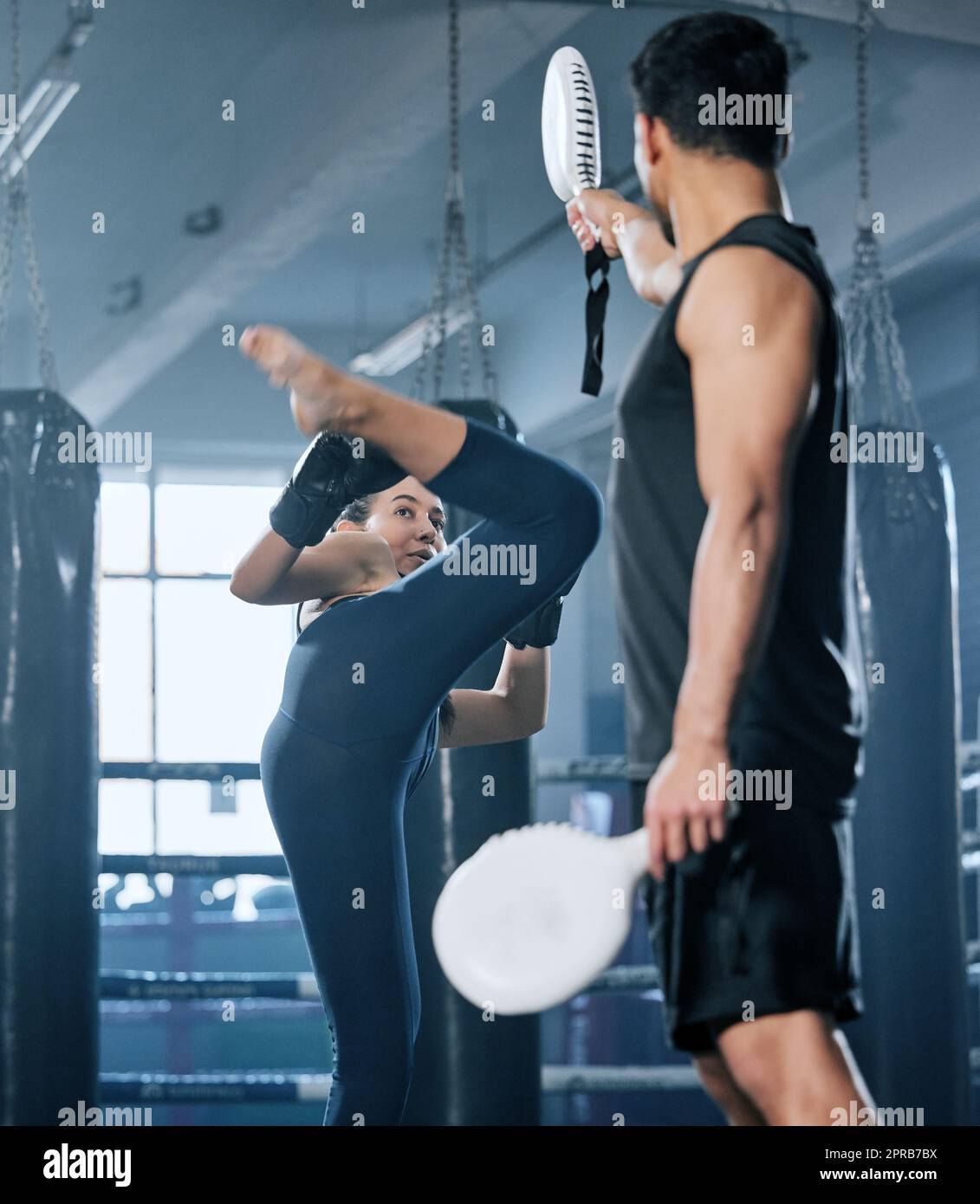 Young woman performing high kick hi-res stock photography and images ...