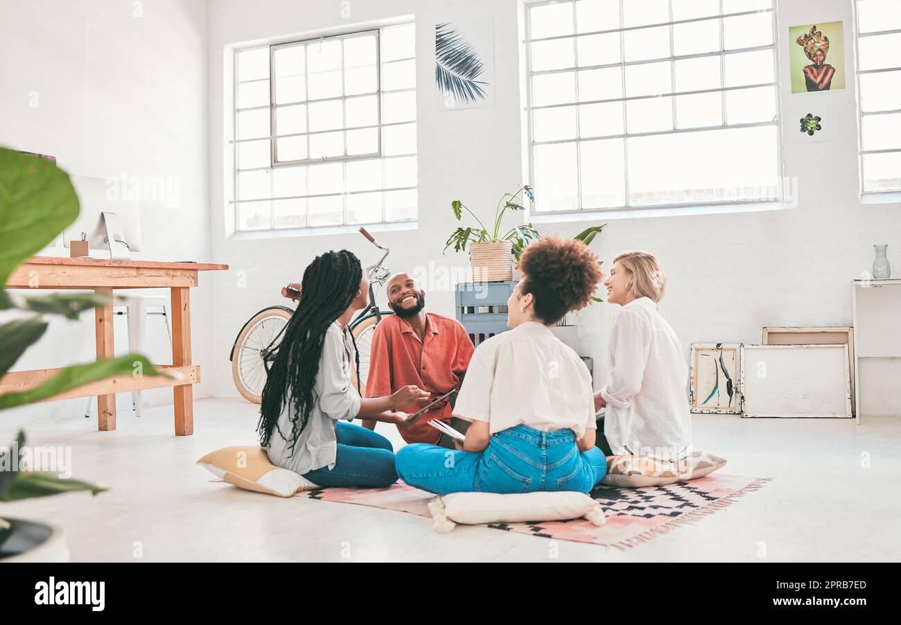 Happy, relaxed and talking business group laughing and bonding while ...