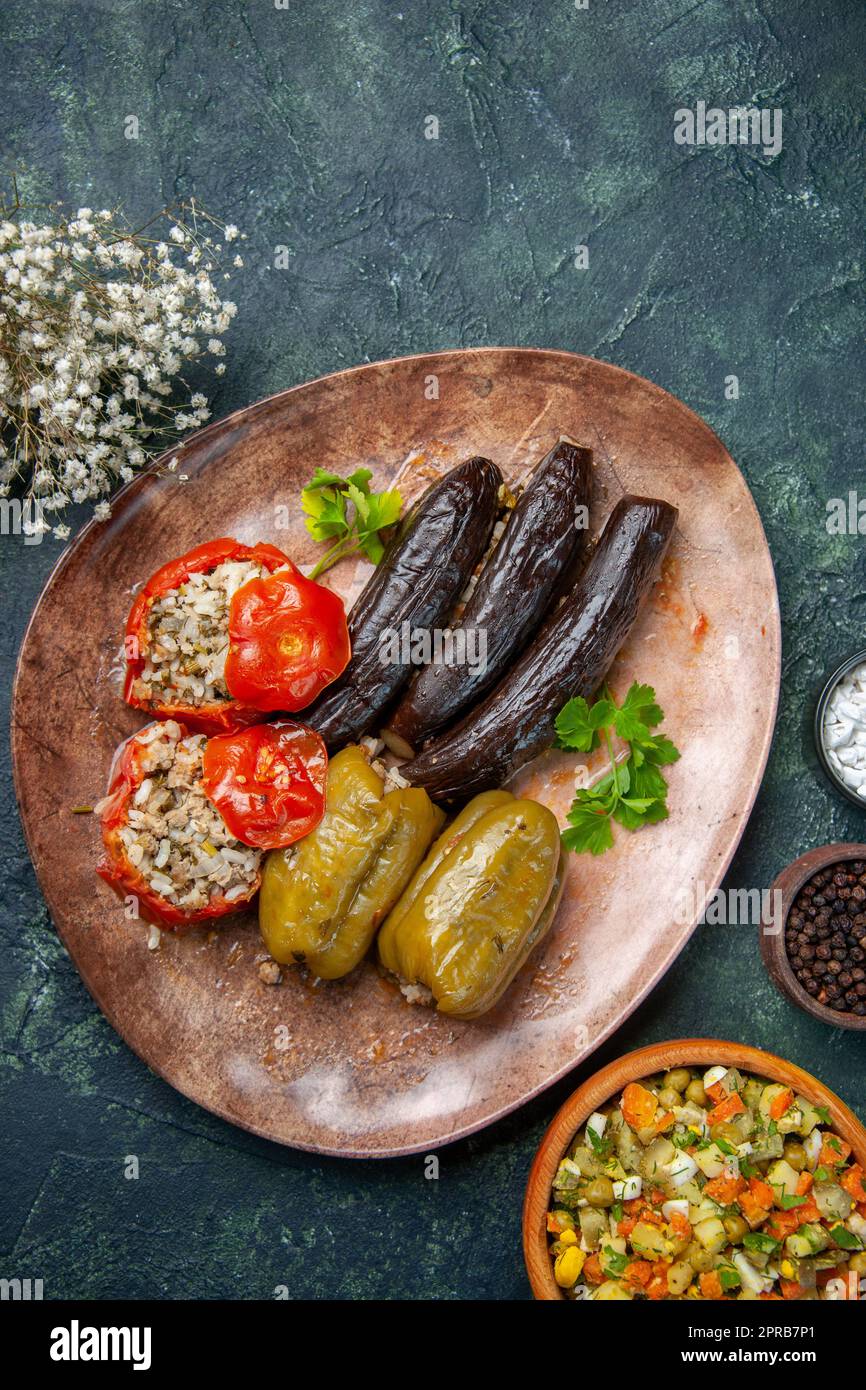 top view delicious vegetable dolma meal filled with ground meat on blue ...