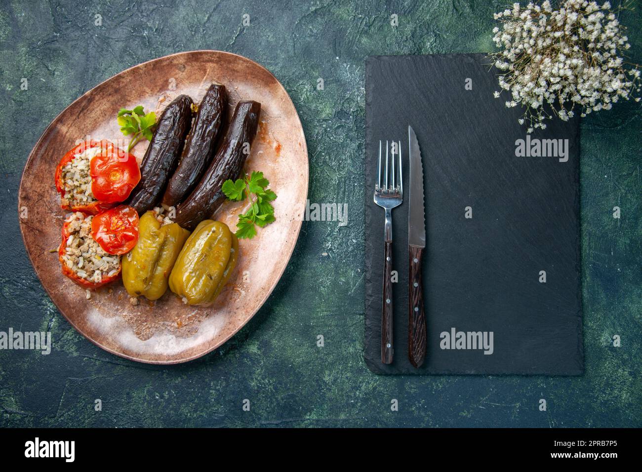 top view delicious vegetable dolma meal filled with ground meat on blue ...