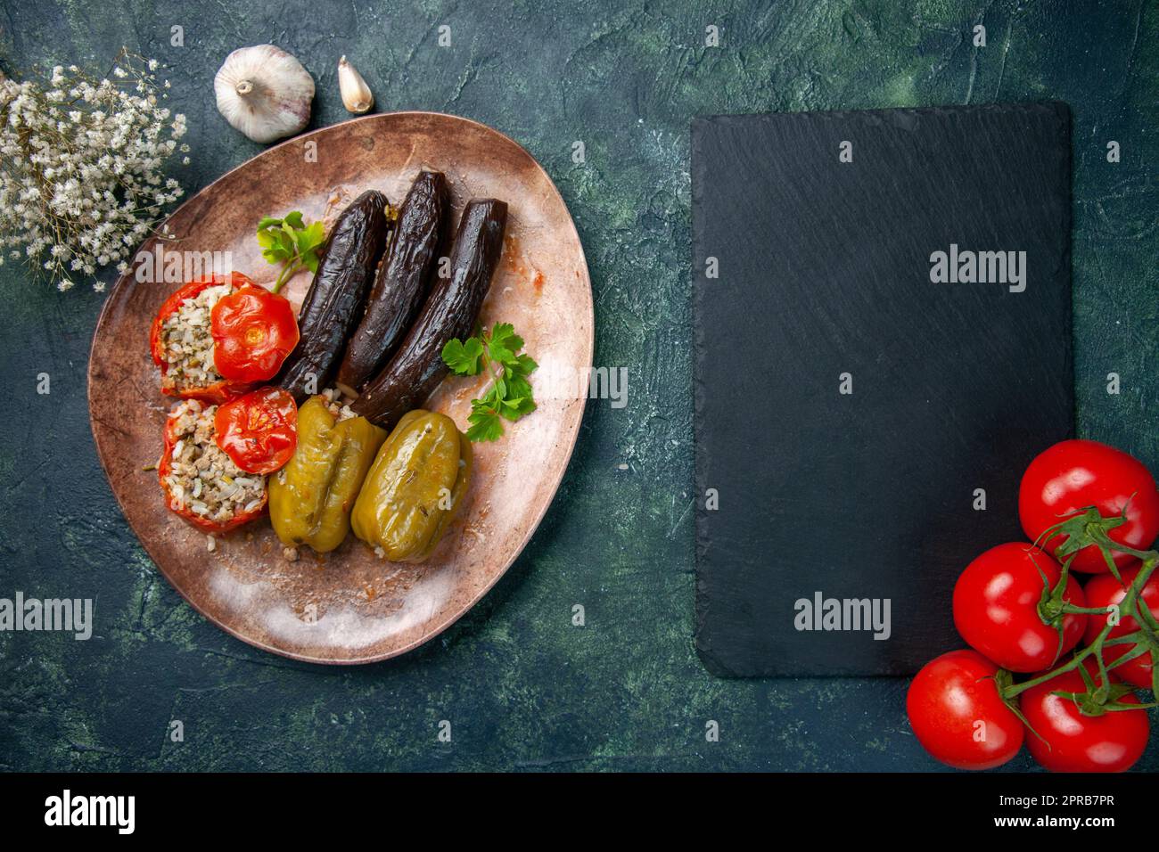 top view delicious vegetable dolma meal filled with ground meat on blue ...
