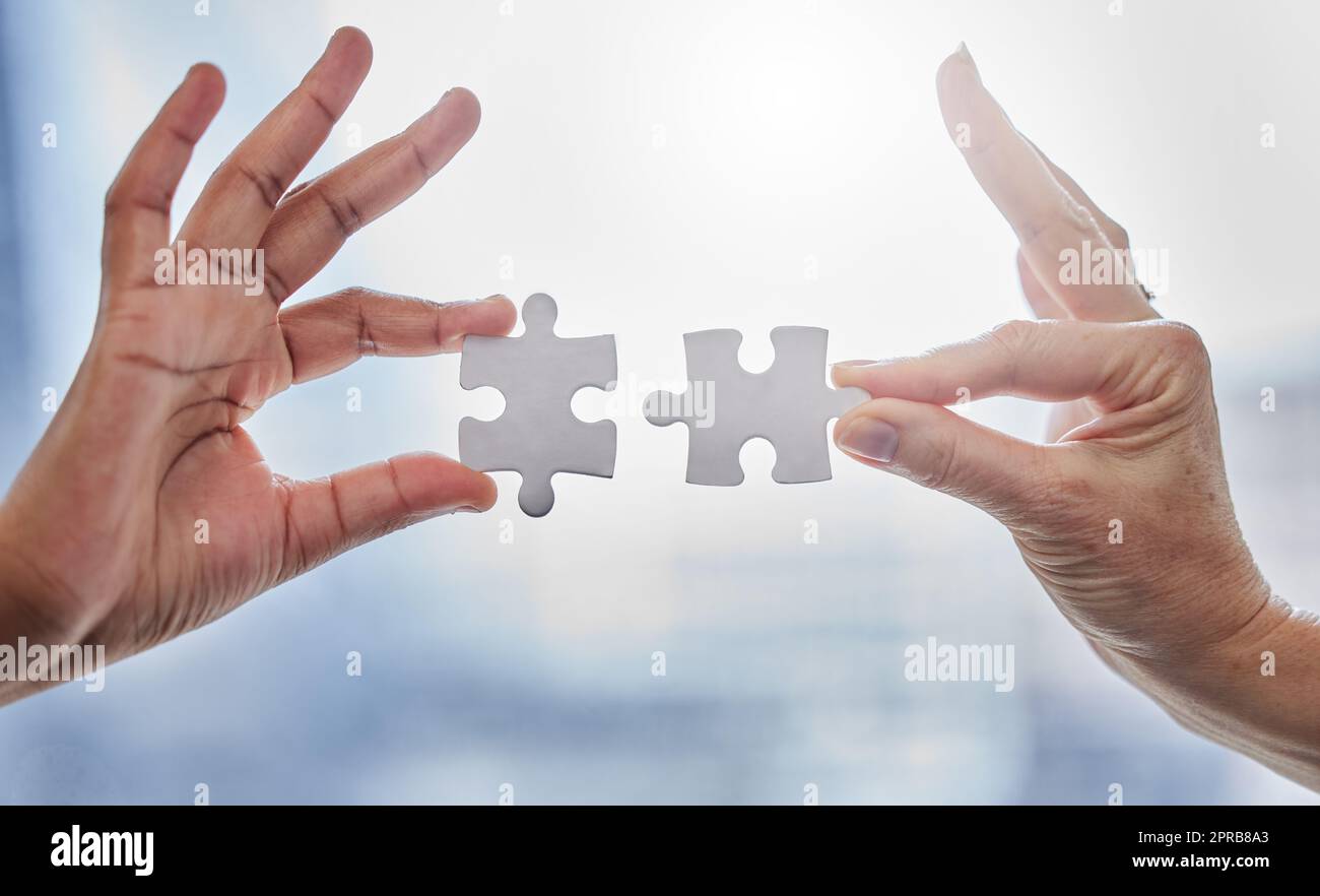 Sometimes you need help to put the pieces together. two people joining ...