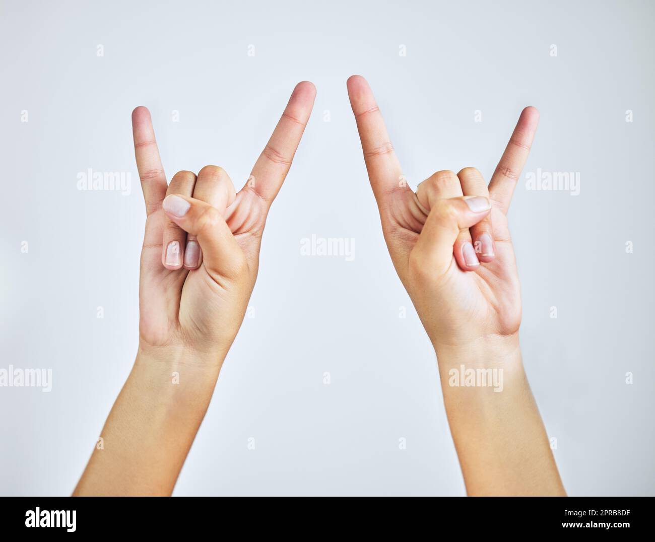 Woman making hand gesture rock hi-res stock photography and images - Alamy