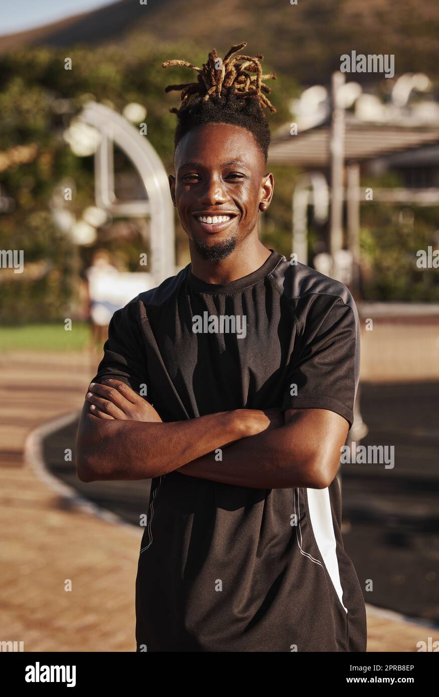 Its a great day for a workout. a young man before his workout routine ...