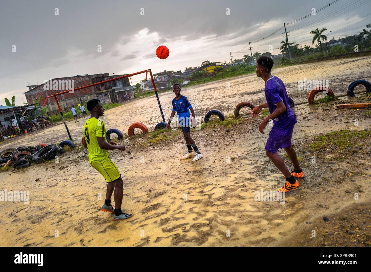 Young Afro-Colombian football players perform a circle passing drill ...