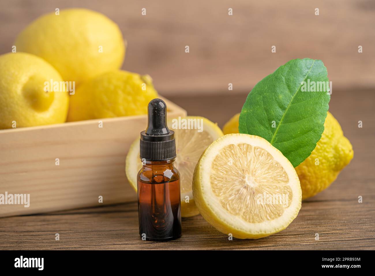 Lemon ripe fresh fruit with leaf on wooden background with copy space ...
