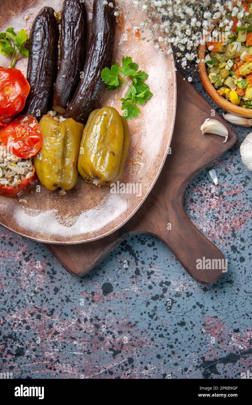 top view delicious vegetable dolma with salad on blue background food ...