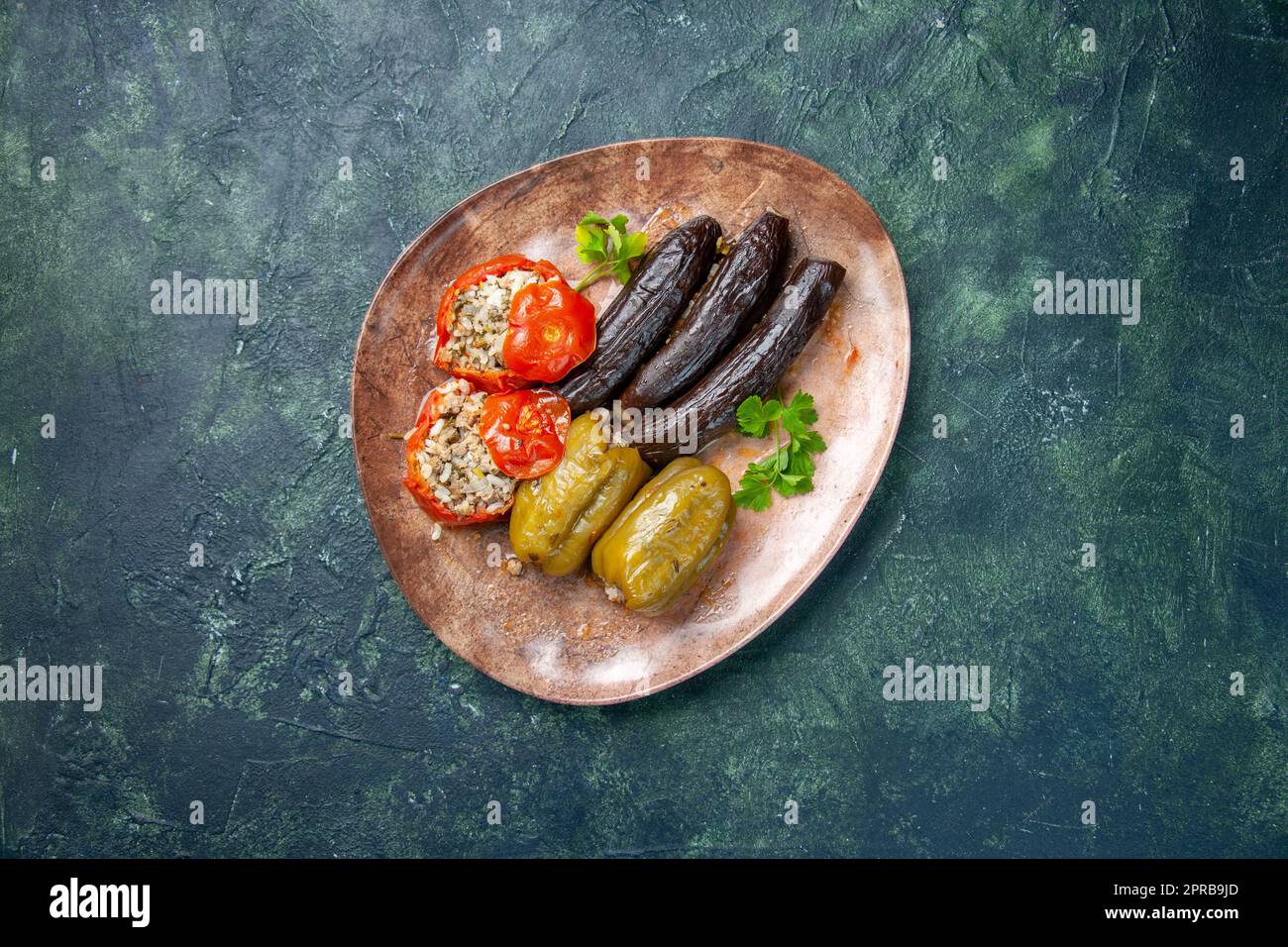top view delicious vegetable dolma meal filled with ground meat on blue ...