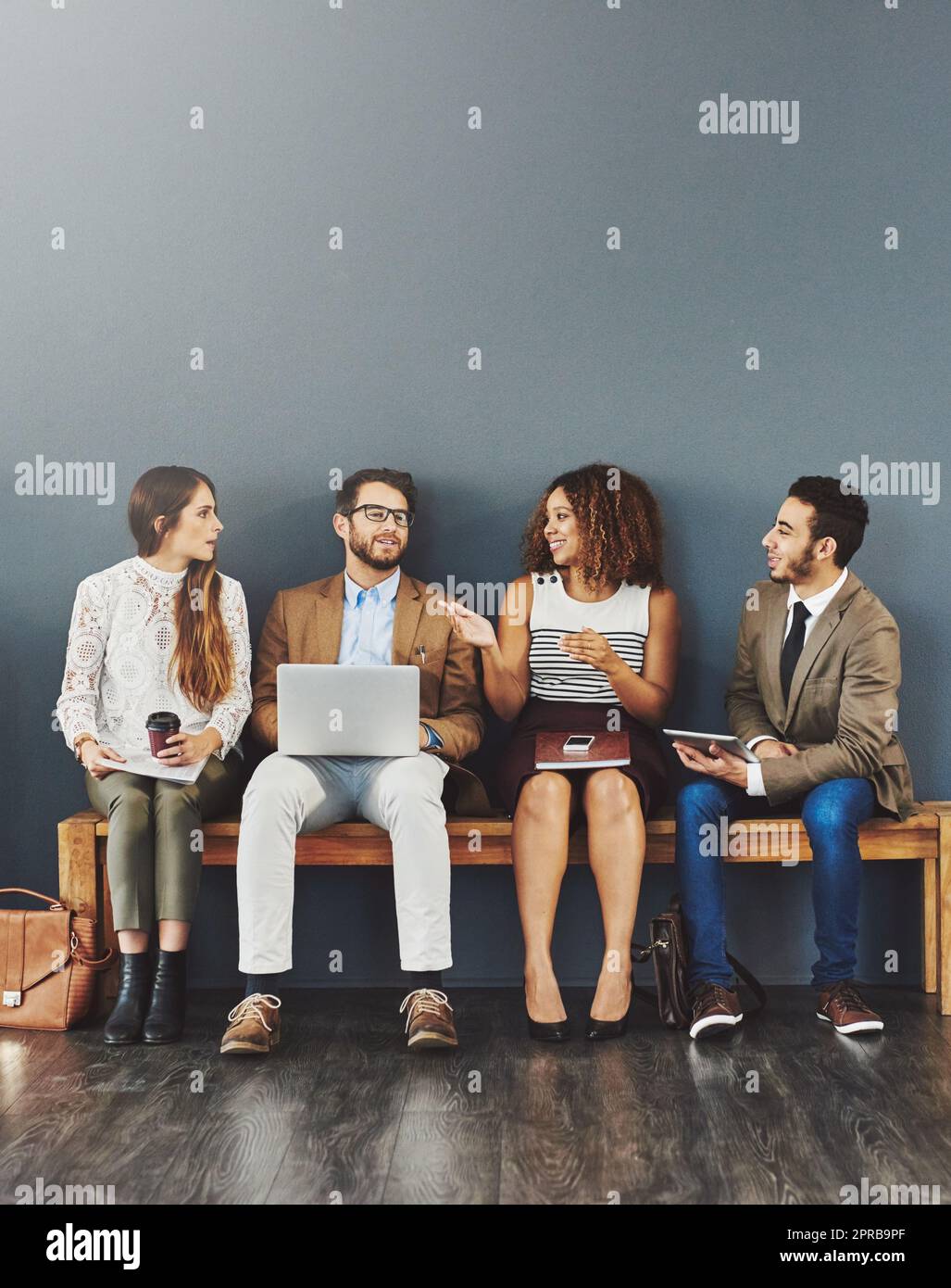 Group of professional business people talking while having a meeting ...