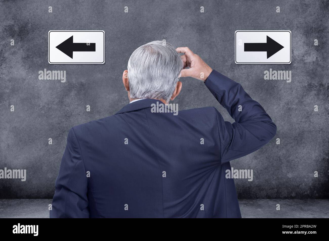 A rear view of thinking, confused and deciding businessman struggling ...