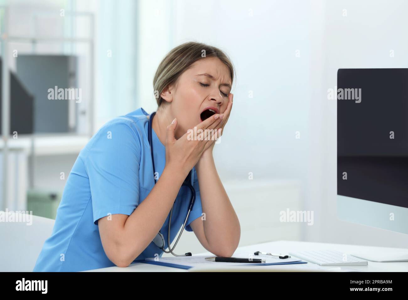 Doctor yawning hi-res stock photography and images - Alamy