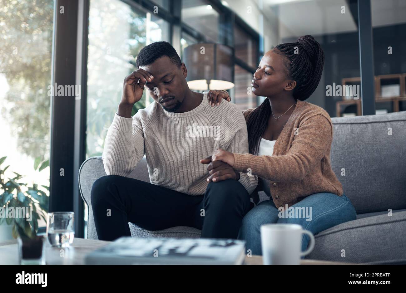 Woman comforts man hi-res stock photography and images - Alamy