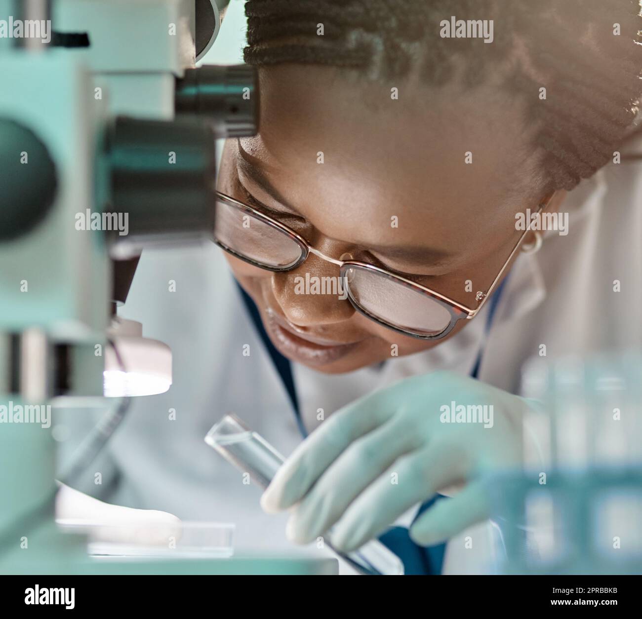 Young scientist using a microscope hi-res stock photography and images - Alamy