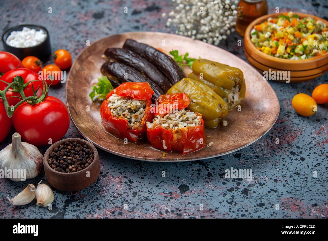 front view eggplant dolma with cooked tomatoes and bell-peppers filled ...