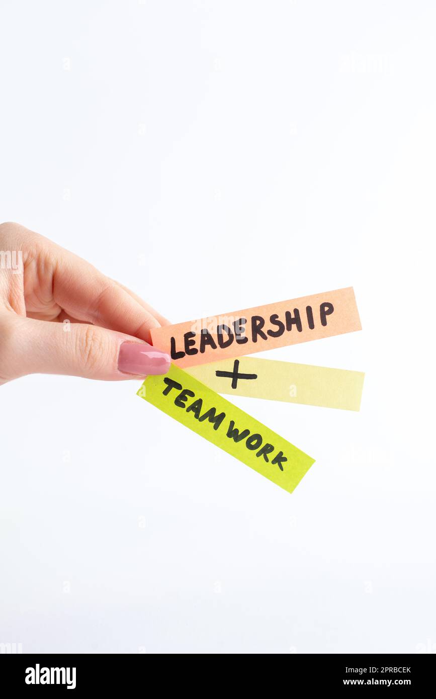 front view leadership teamwork little stickers in female hands on white ...