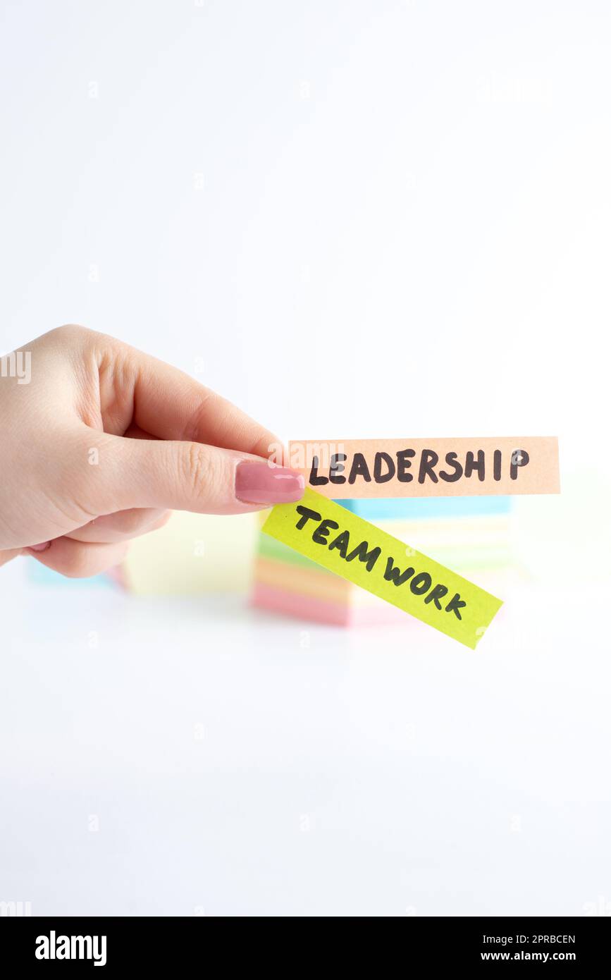 front view leadership teamwork little stickers in female hands on white ...