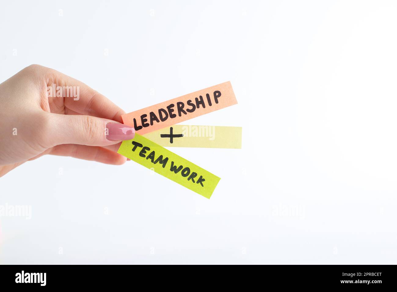front view leadership teamwork little stickers in female hands on white ...