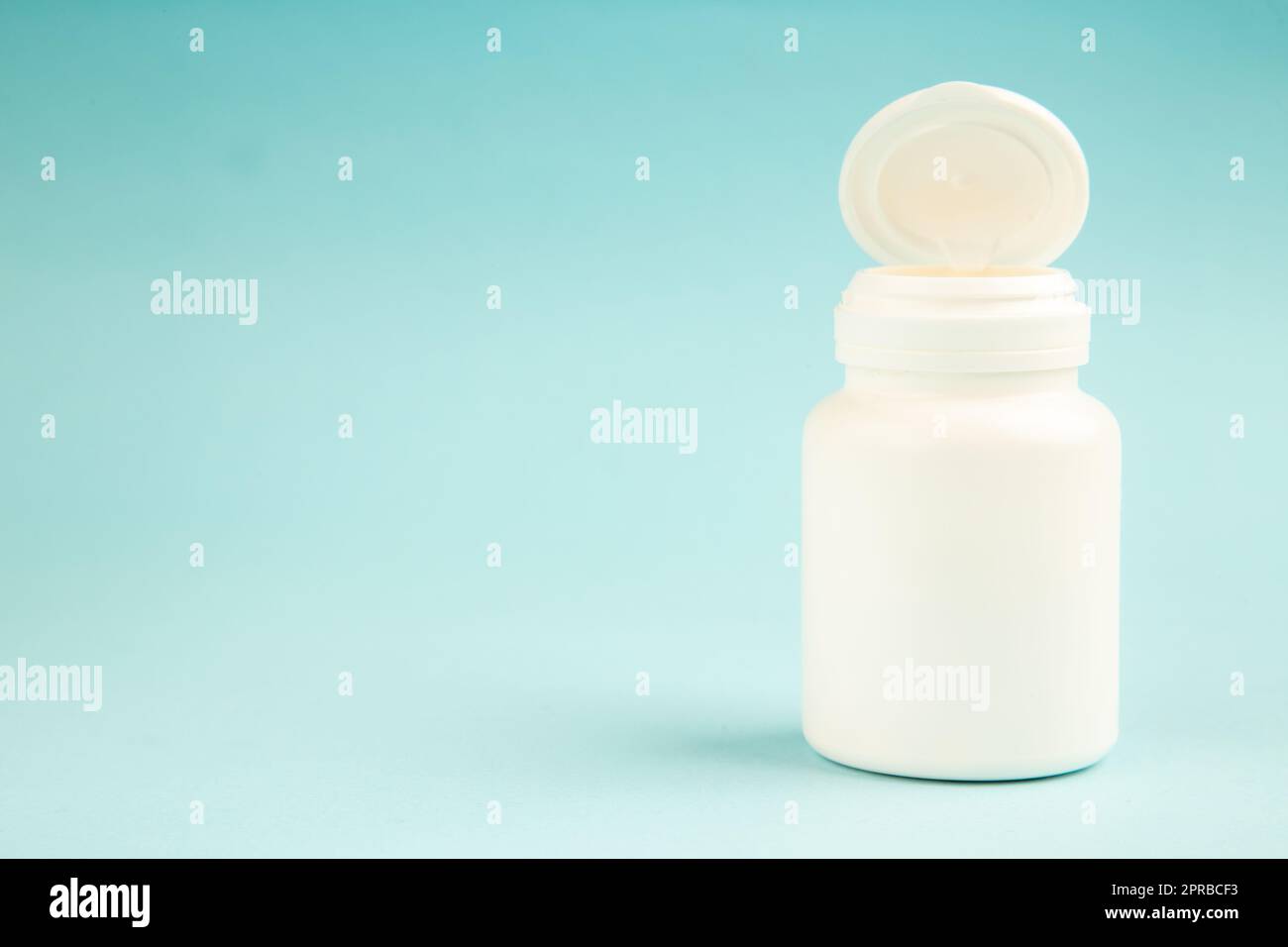 front view little pills can on blue background color virus pandemic ...