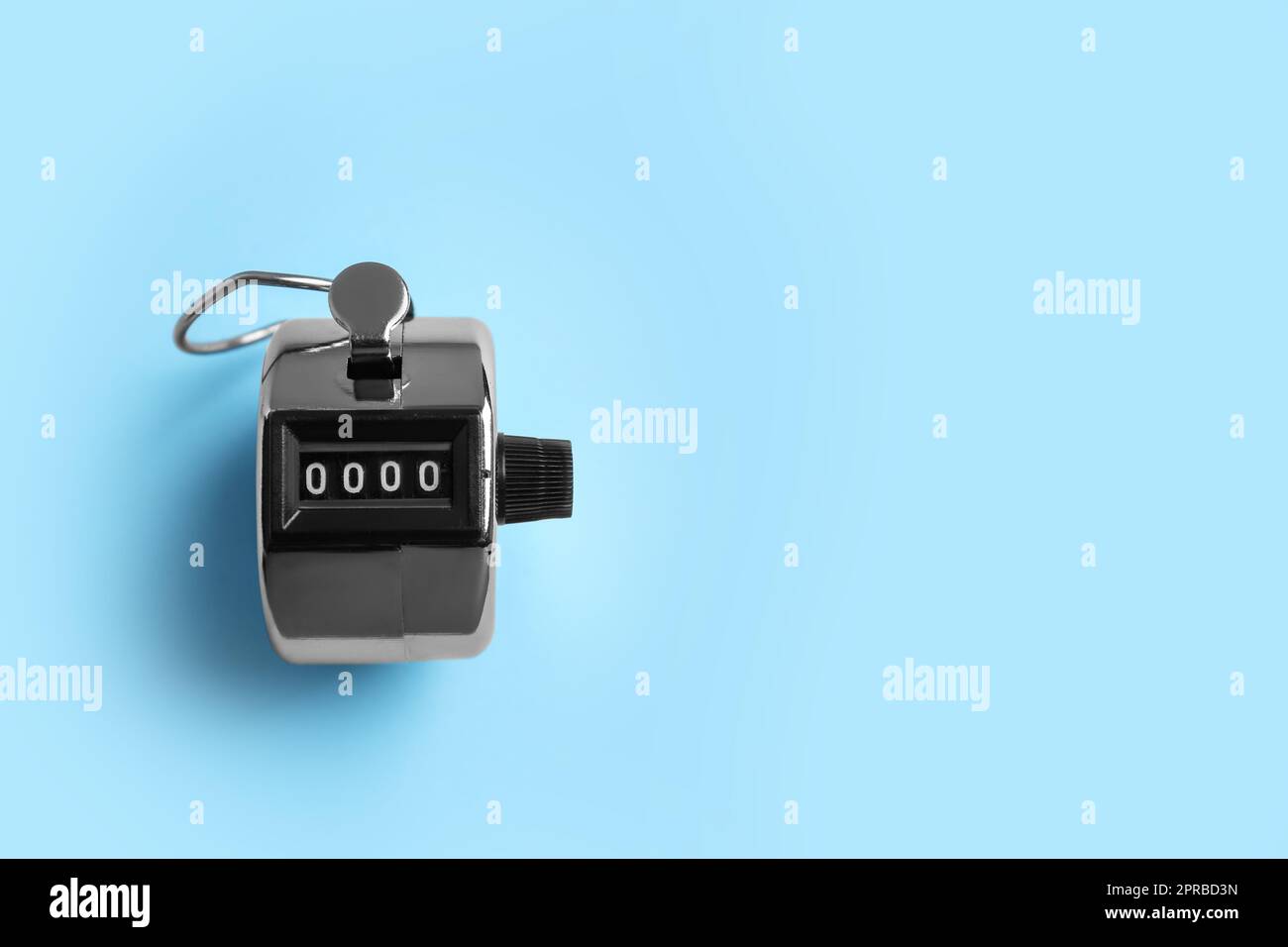 Modern timer on light blue background, top view. Space for text Stock ...