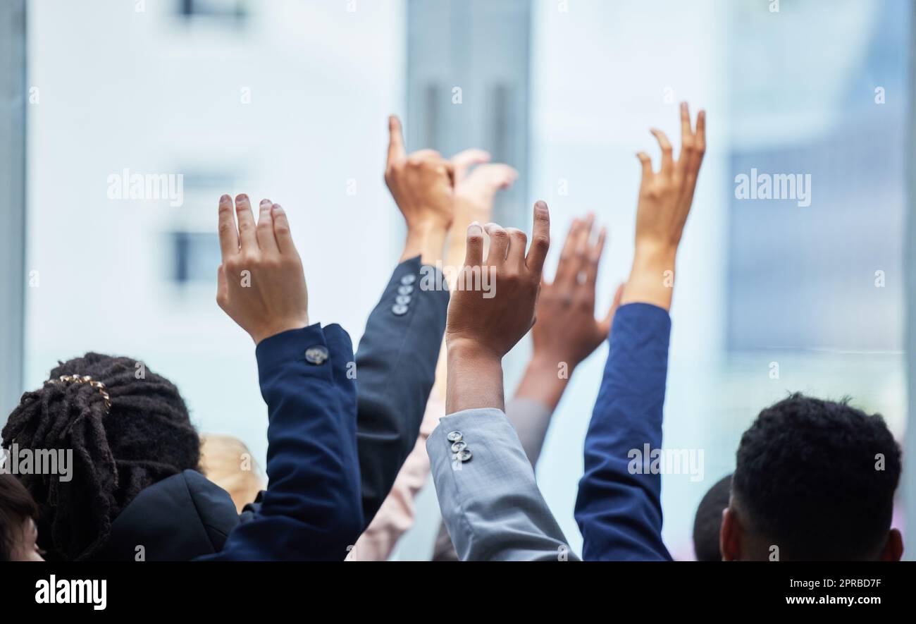 Group of hands raised behind office hi-res stock photography and images ...