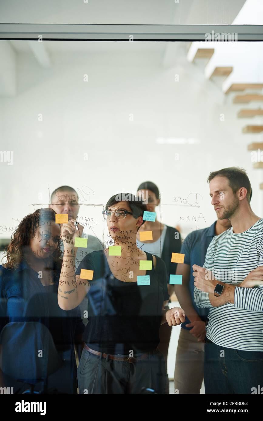 Manager, leader or boss talking and planning in a workshop, seminar or ...