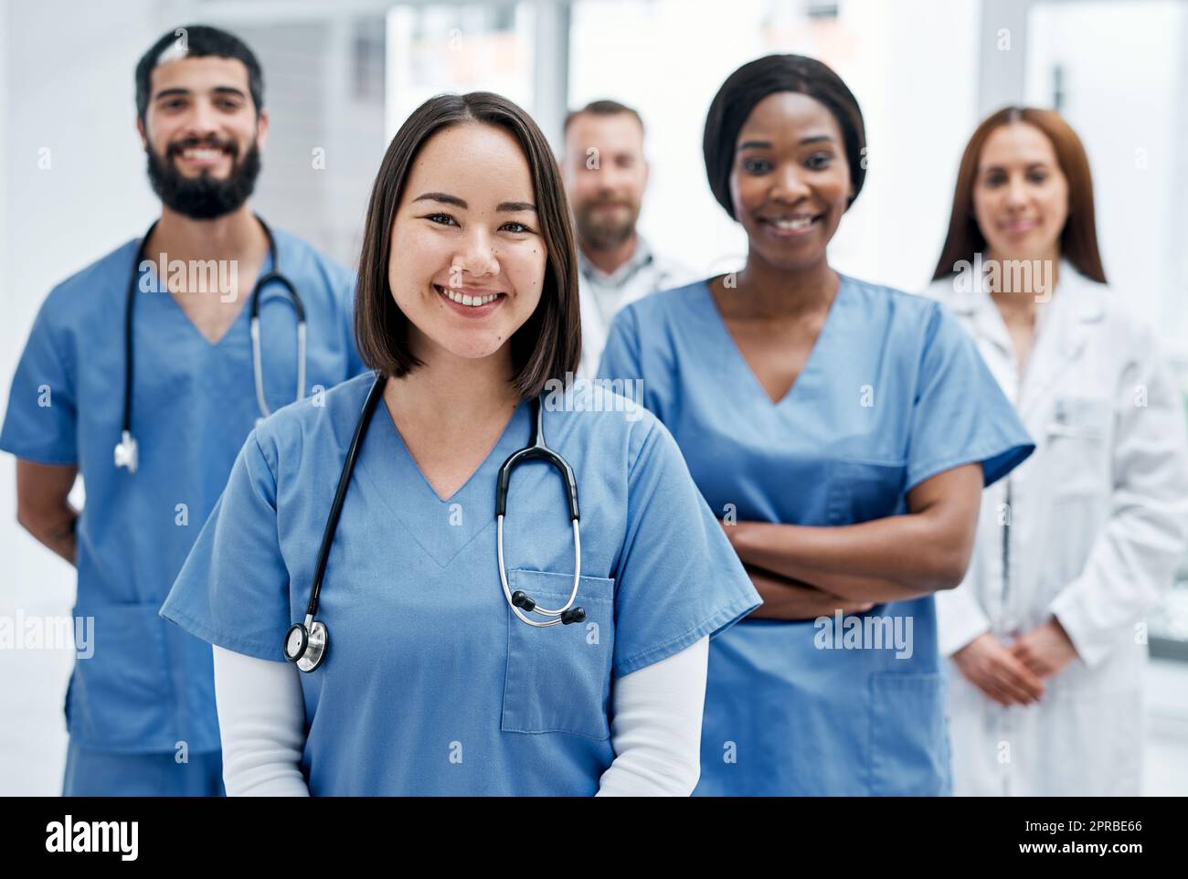 Here to help you take the path to improved health. Portrait of a group of medical practitioners ...