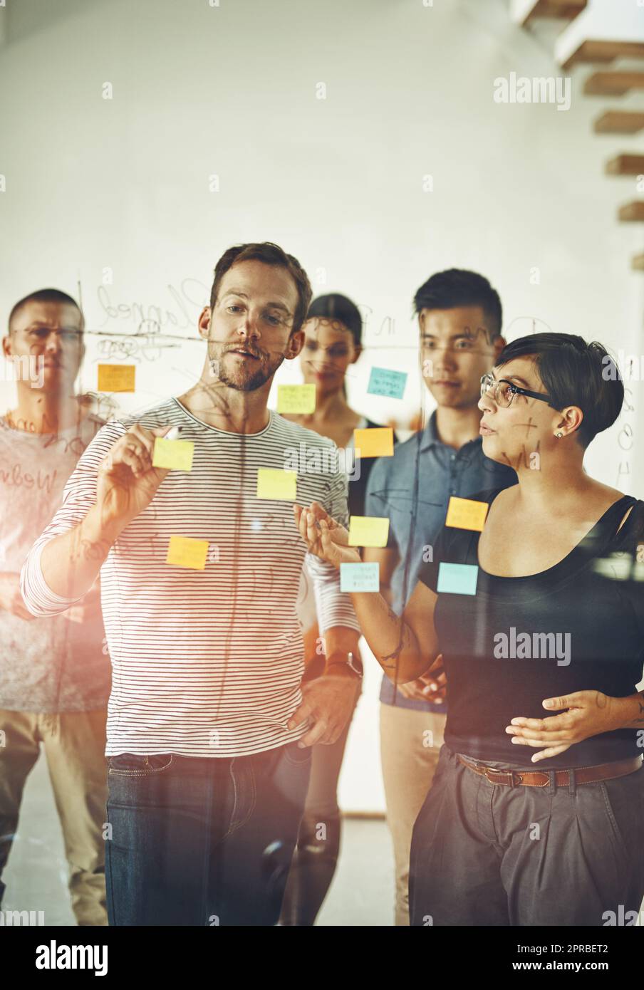 Working, thinking and brainstorming office team using colorful notes to ...