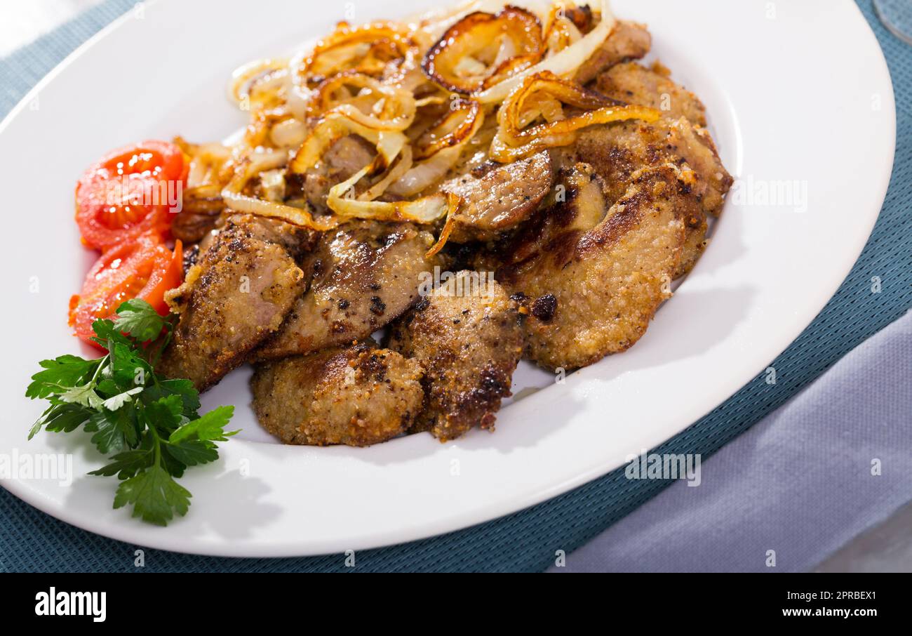 Fried rabbit liver with onion Stock Photo - Alamy