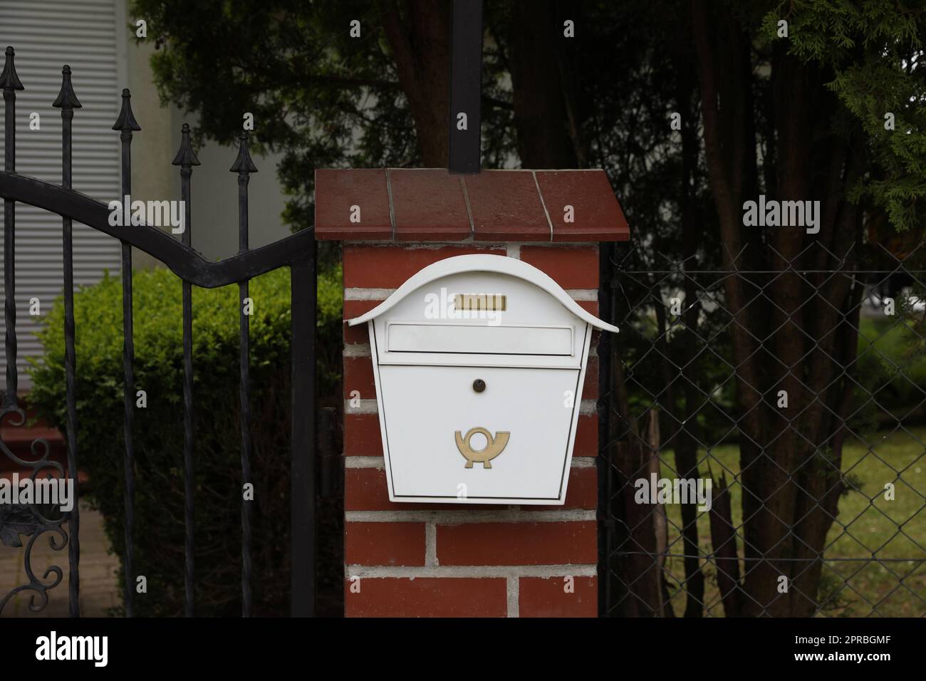 White metal letter box on fence outdoors Stock Photo - Alamy