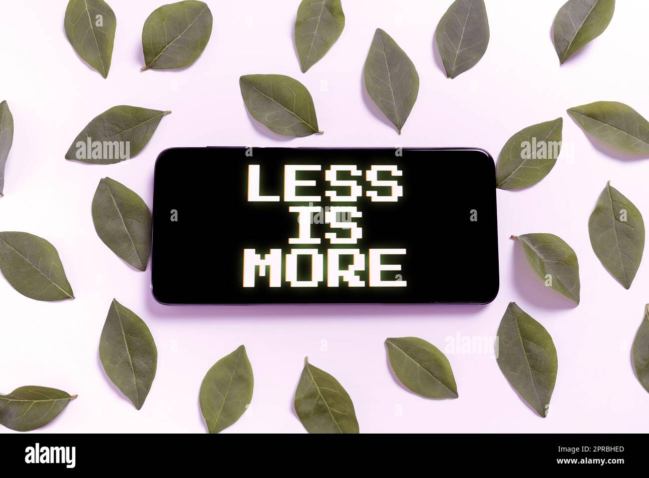 Hand writing sign Less Is More. Business overview Minimalist approach ...